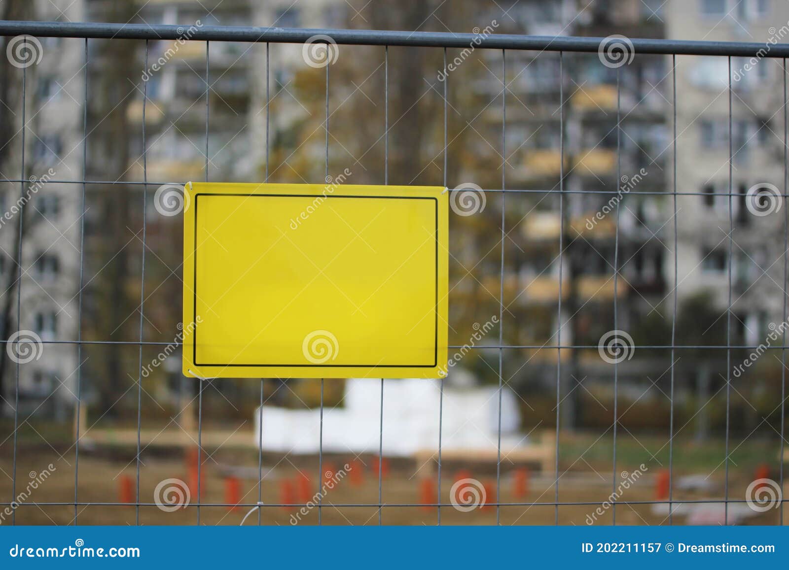 Yellow Sign on the Fence at the Construction Site Stock Image - Image ...