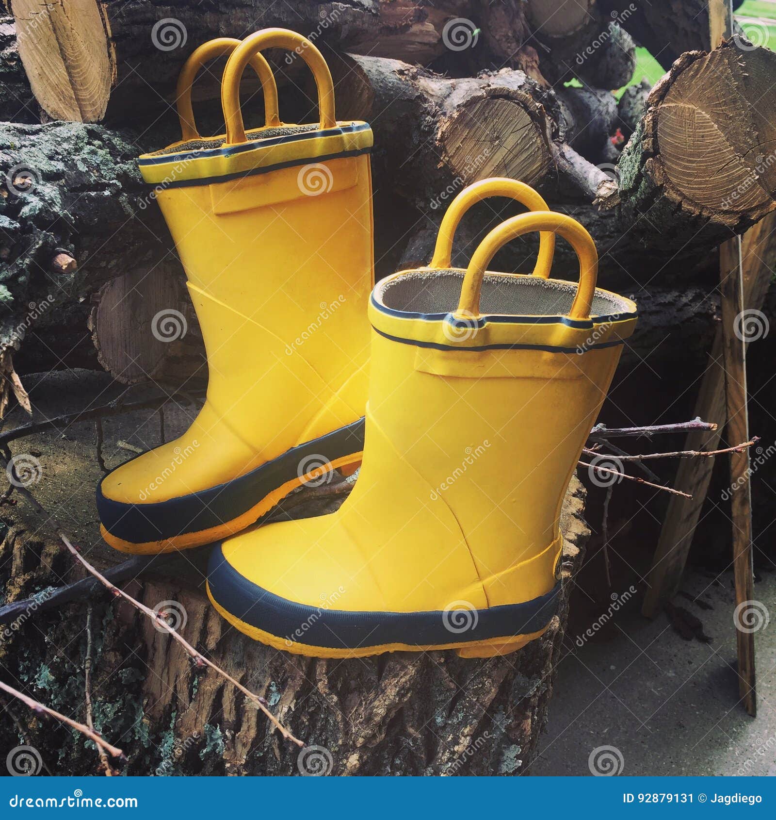 Yellow Slickers on a Pile of Wood Stock Image - Image of boots, wood ...