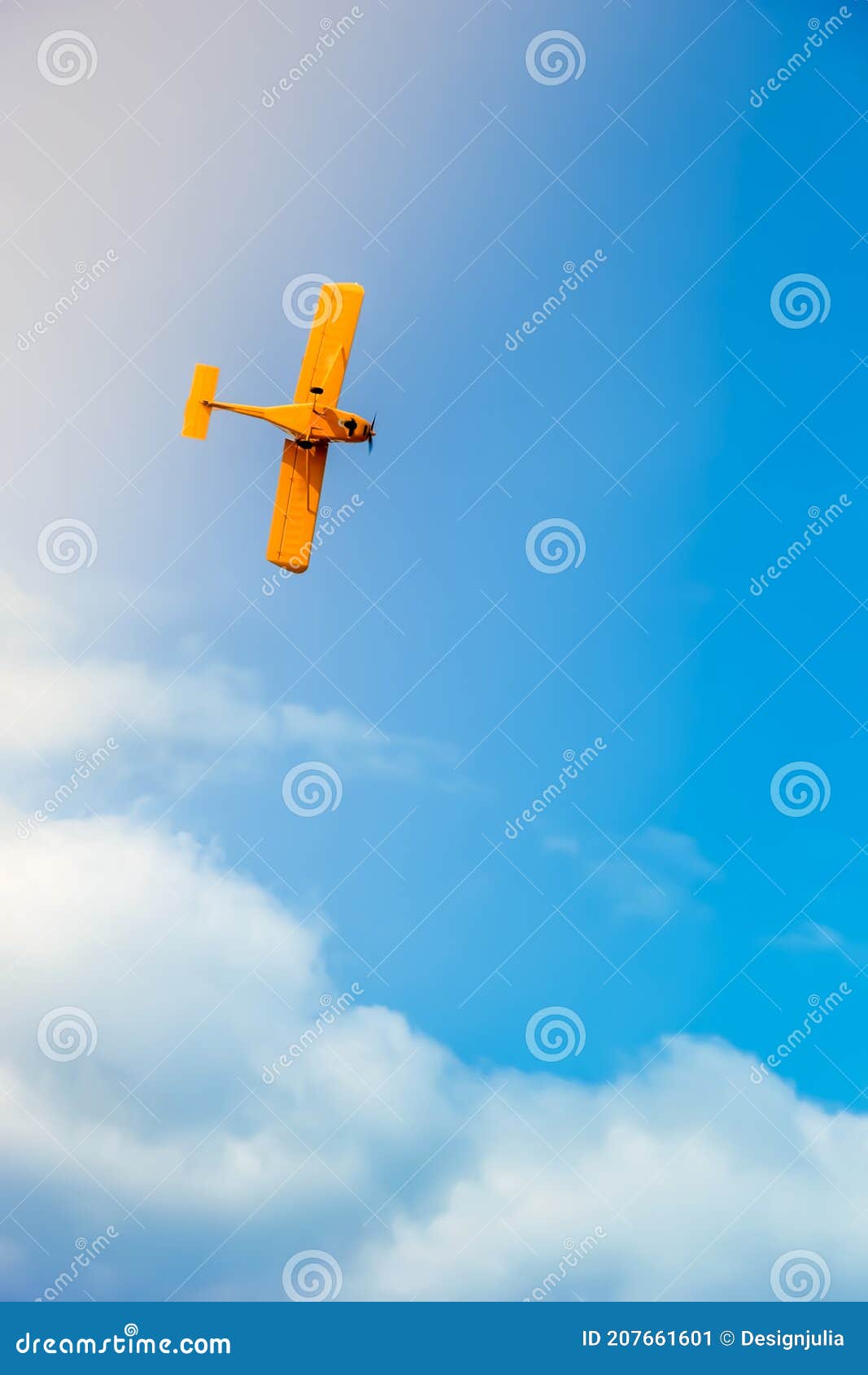 Yellow Small Two-pilot Airplane in the Blue Cloudy Sky Stock Image ...