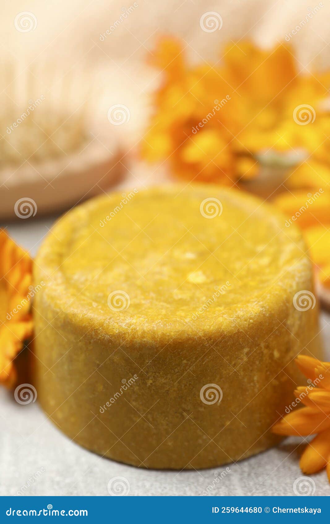 Yellow Solid Shampoo Bar and Flowers on Light Table, Closeup. Hair Care ...