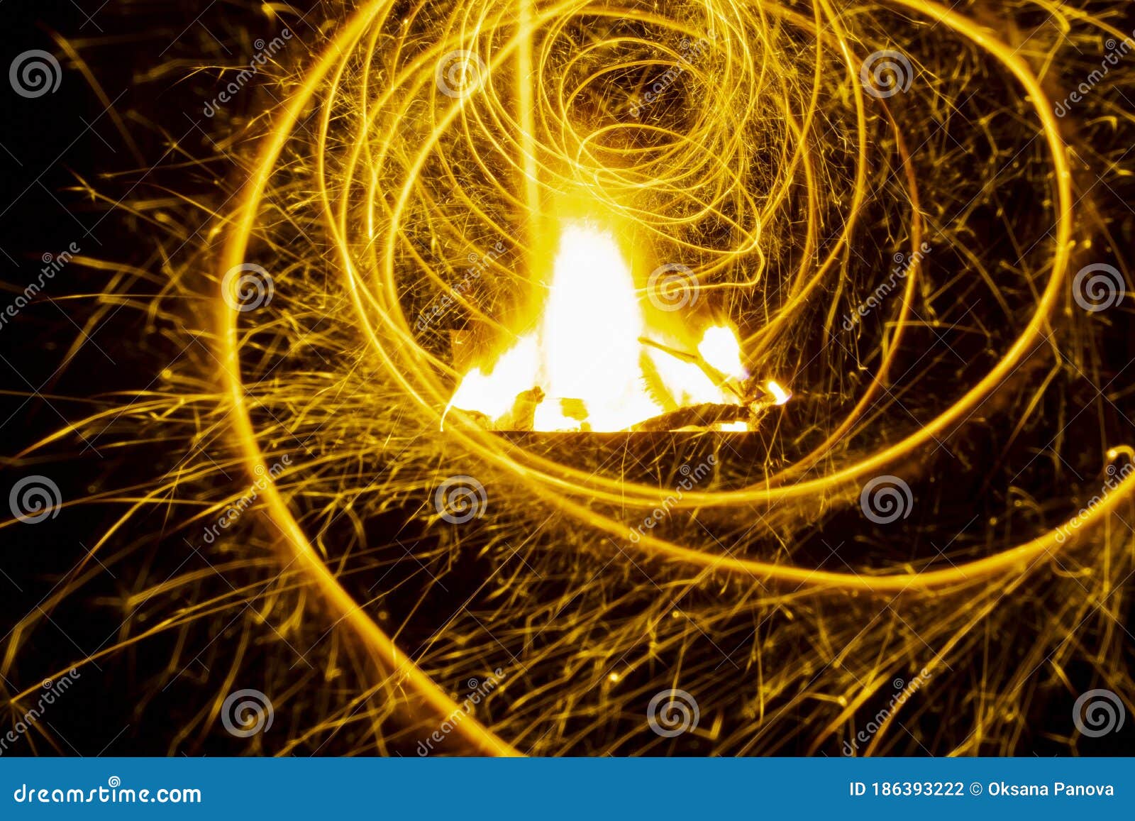 Yellow Sparks of Fire Against a Dark Background Stock Photo - Image of ...