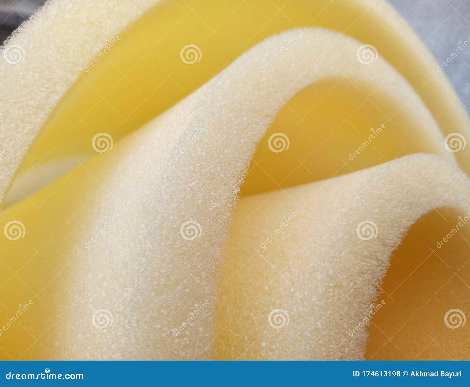 Yellow Sponge Foam Roll with Spiral Shape Stock Photo - Image of macro ...