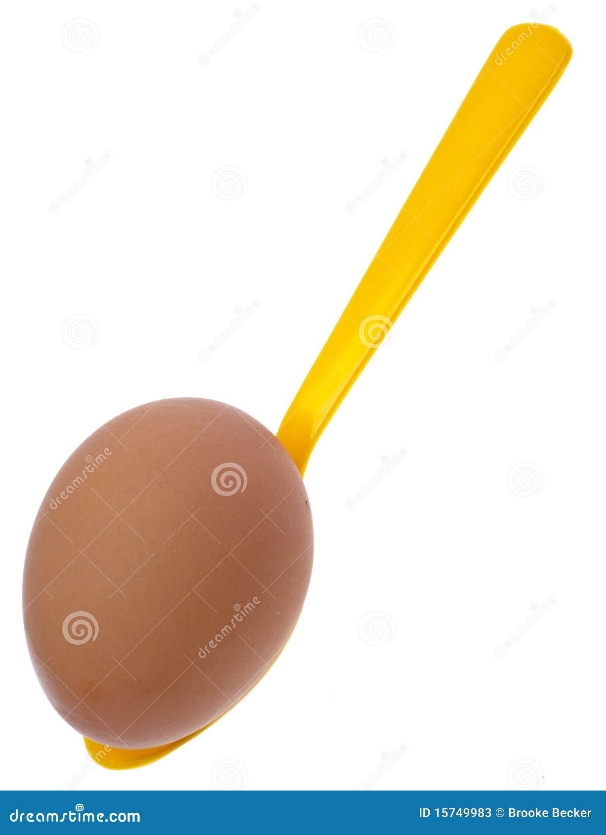 Yellow Spoon with Brown Egg Stock Image - Image of conceptual, small ...