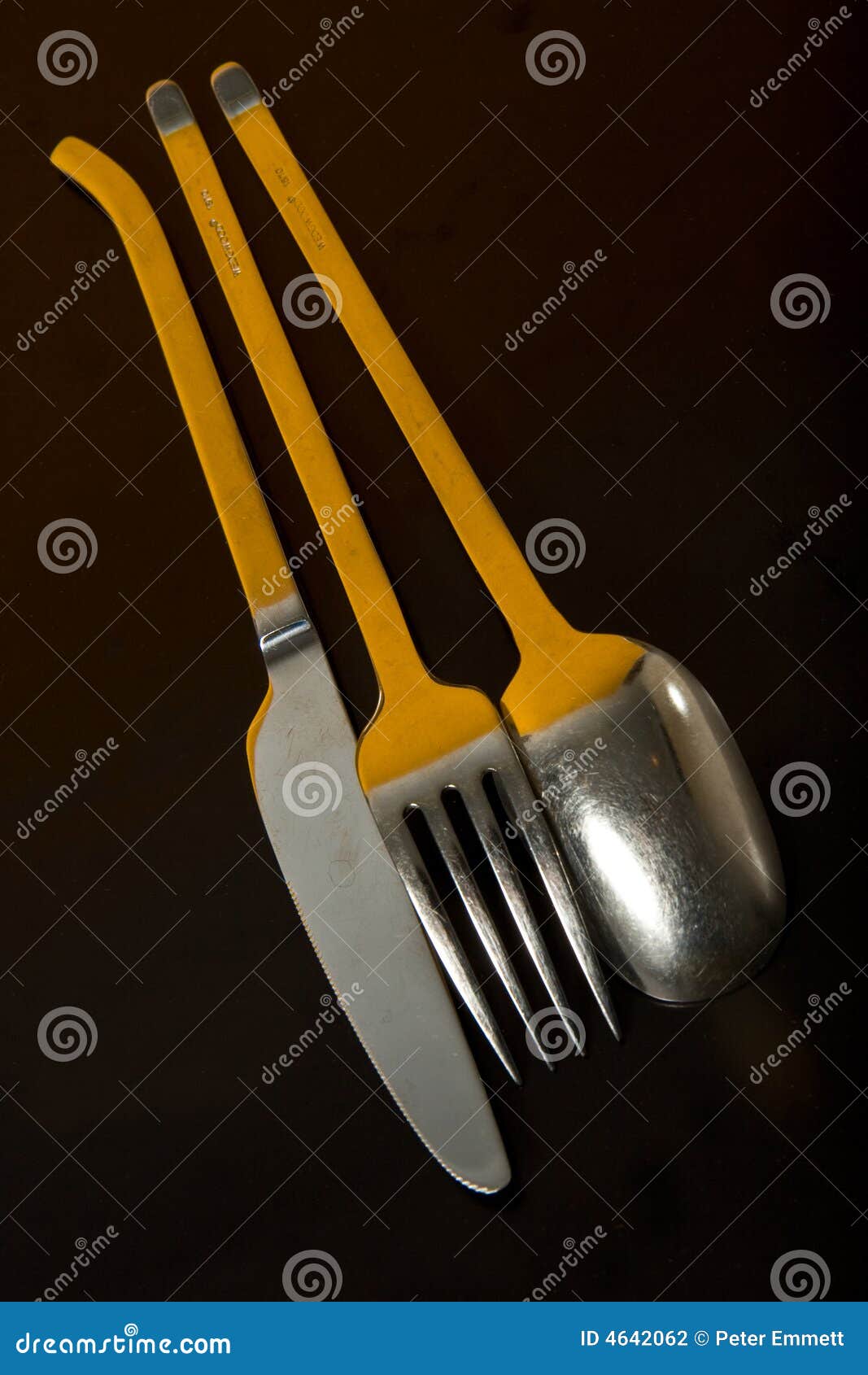 Yellow Spoon Knife and Fork Stock Photo - Image of silver, shiny: 4642062