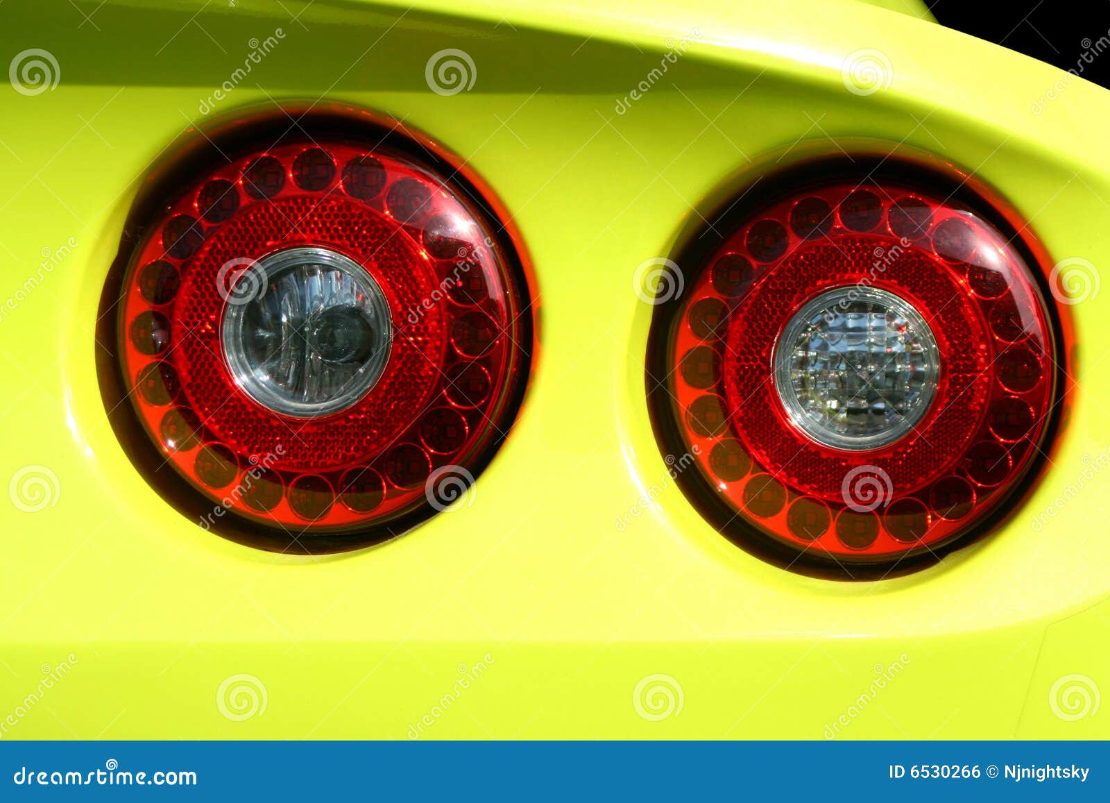 Yellow Sports Car Red Tail Lights Stock Photo - Image of modern, color ...