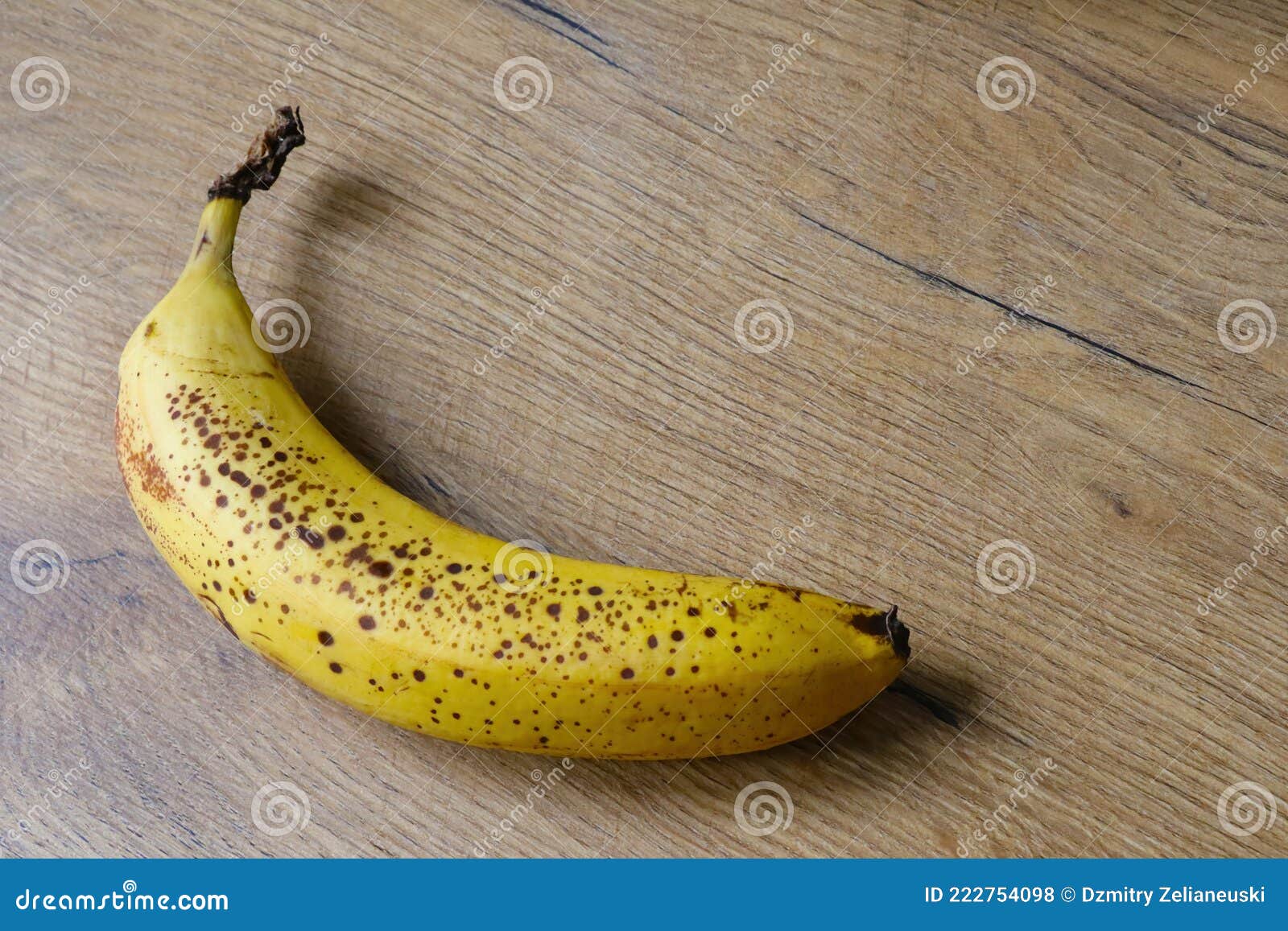 A Yellow Spotted Banana Lies on the Table Stock Photo - Image of health ...