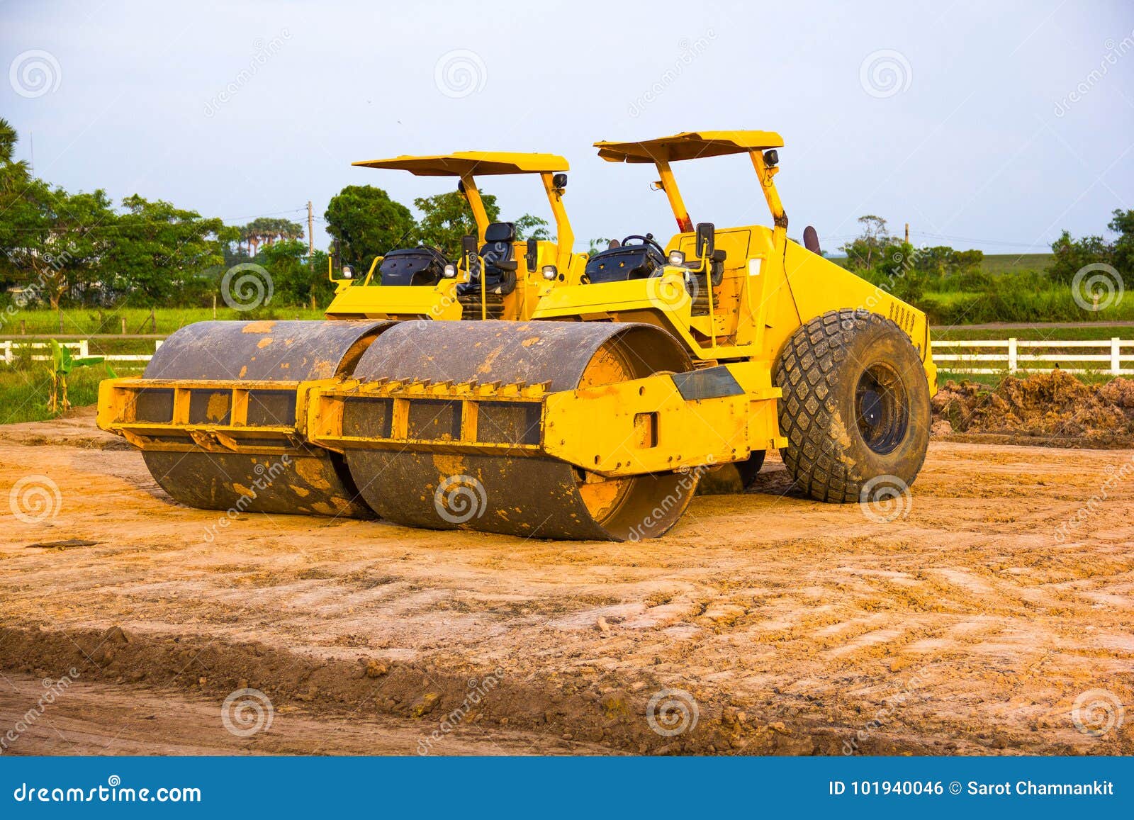 Yellow Steamroller Or Soil Compactor Working On Asphalt Road At ...