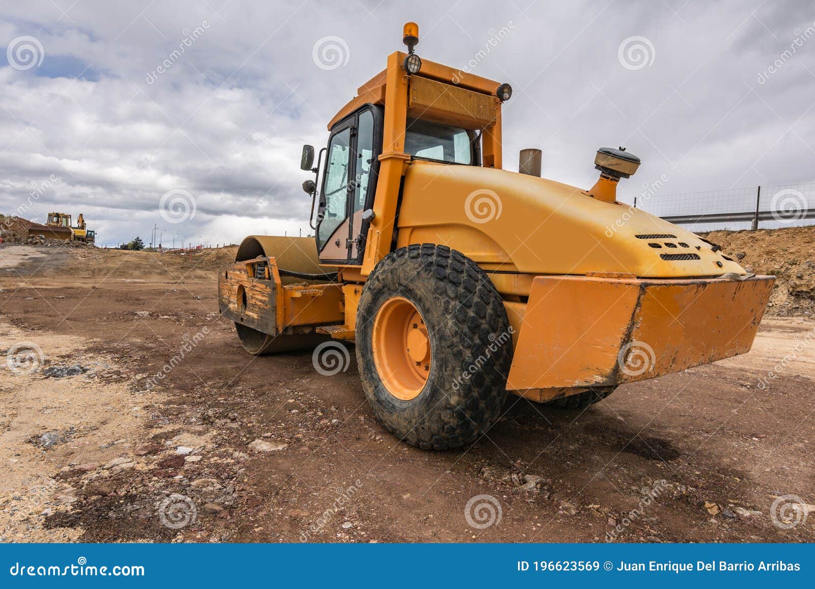 Yellow Steamroller Or Soil Compactor Working On Asphalt Road At ...