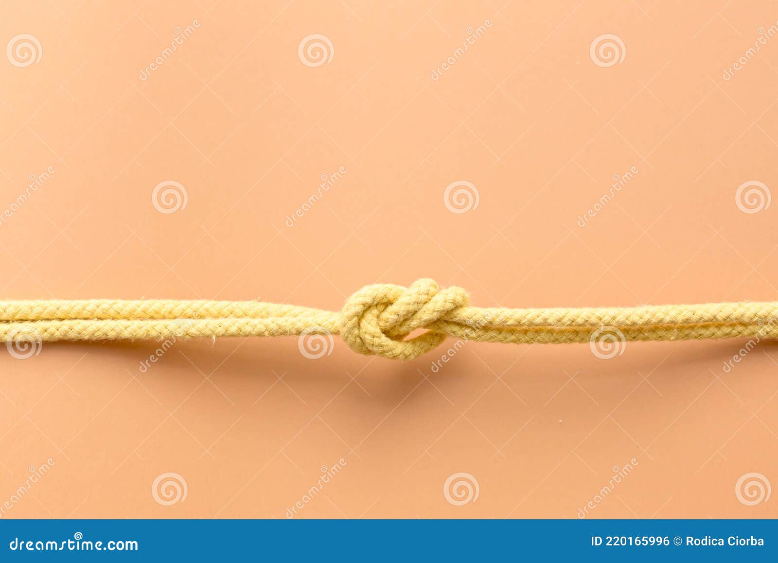 Yellow String Knotted on a Orange Colour Background Stock Photo - Image ...