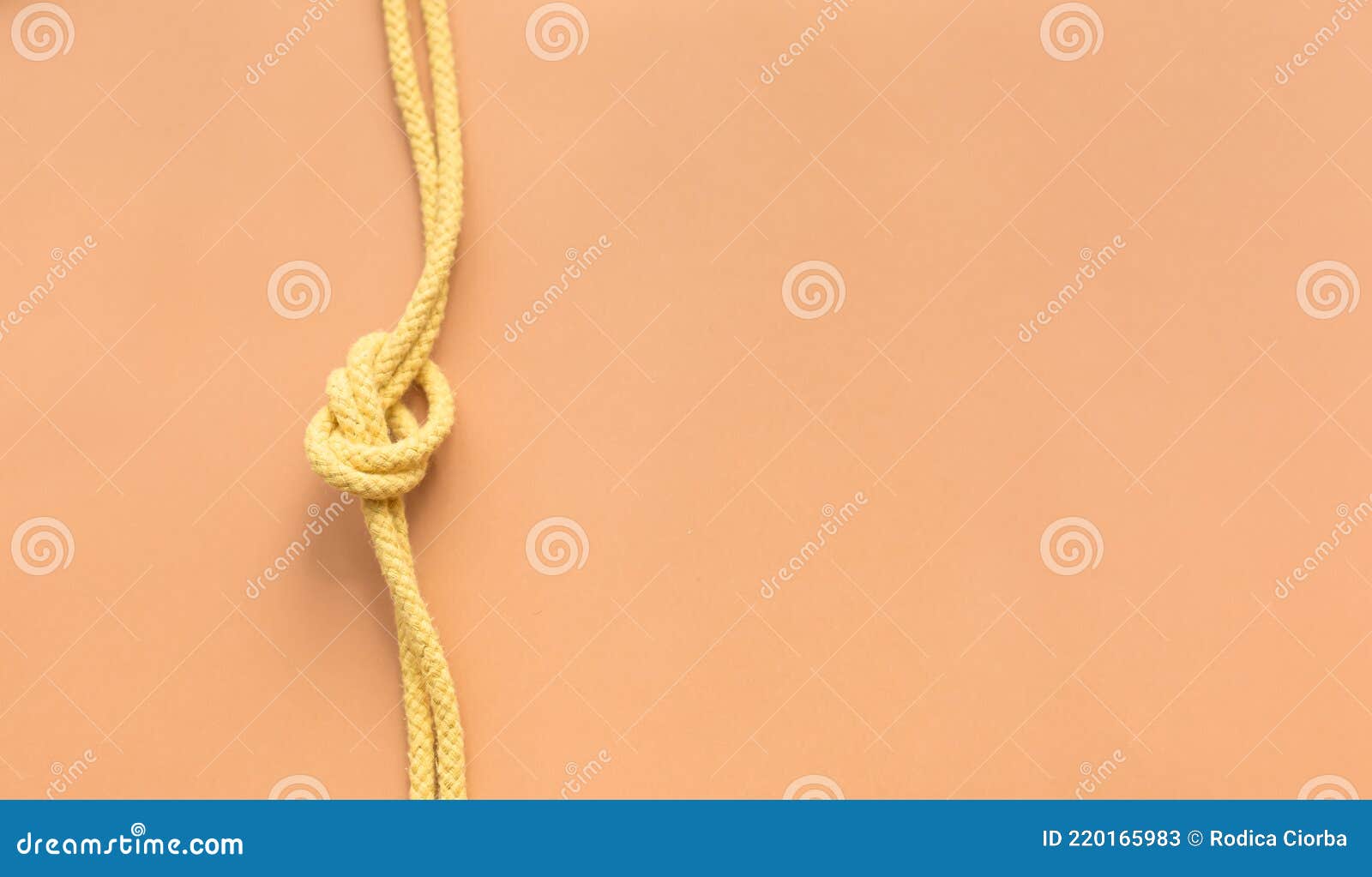 Yellow String Knotted on a Orange Colour Background Stock Image - Image ...