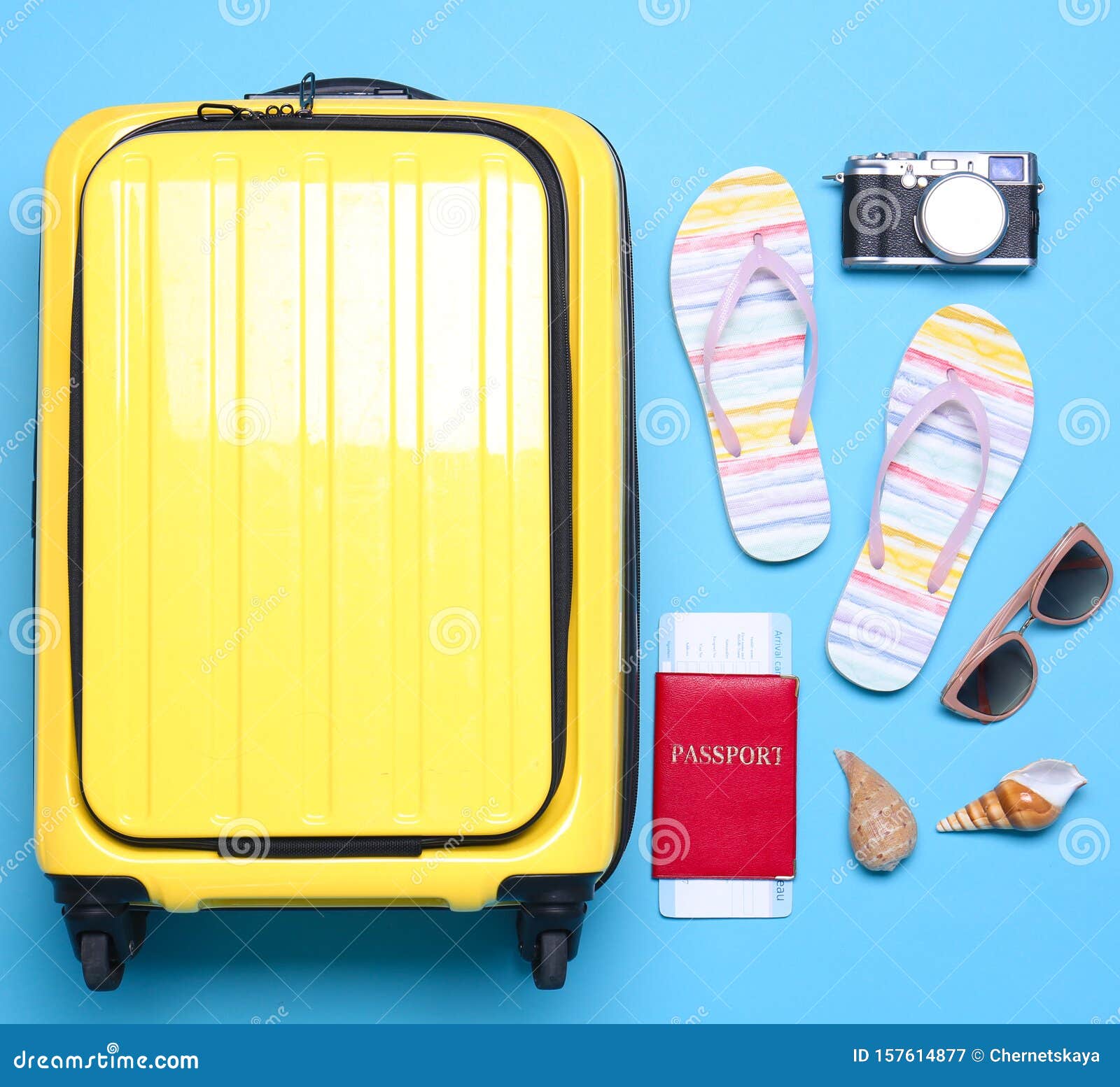 Yellow Suitcase and Objects on Blue Background, Flat Lay Stock Image ...