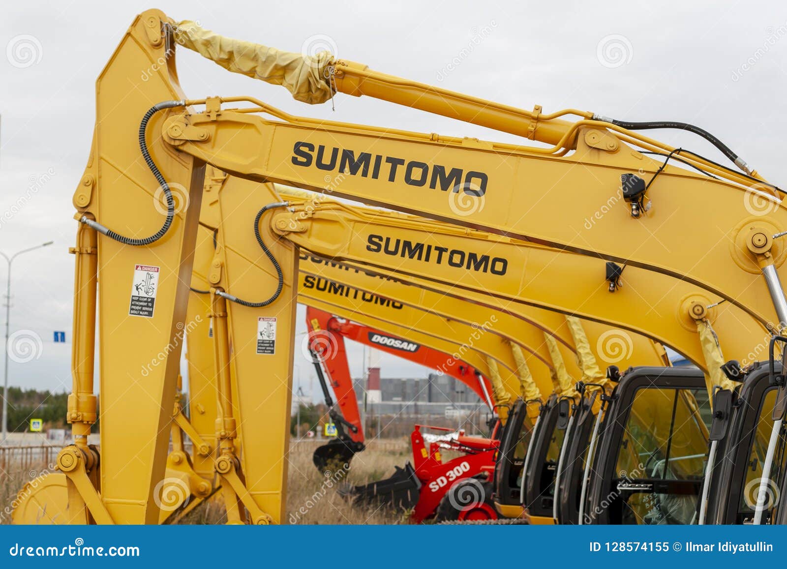 The Yellow Sumitomo Excavators are Lined Up in a Single Line. Editorial ...