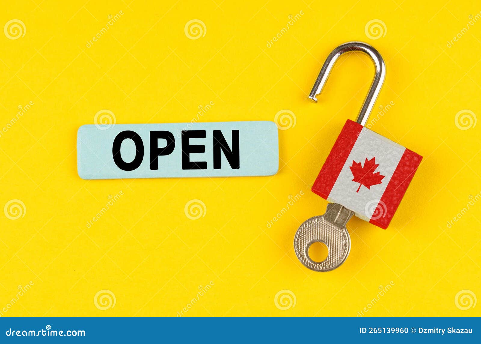 On the Yellow Surface is an Open Lock with a Key and a Sticker with the ...