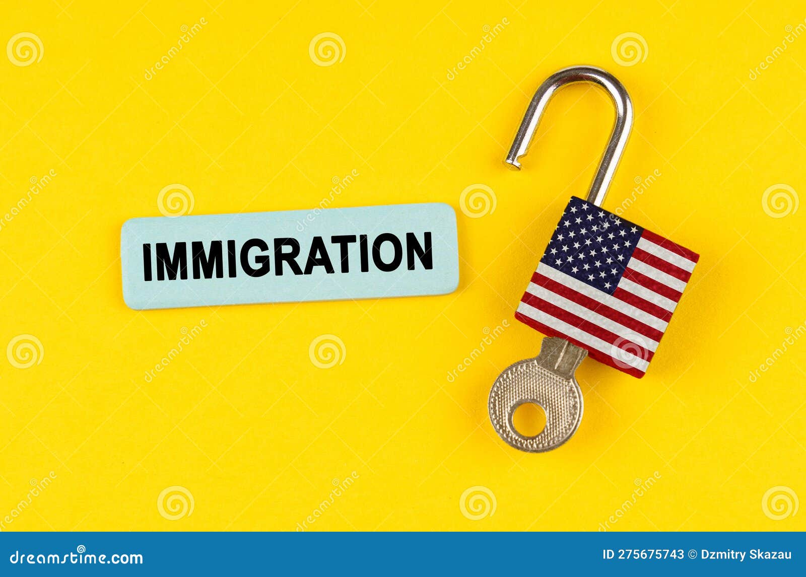 On the Yellow Surface is an Open Lock with a Key and a Sticker with the ...