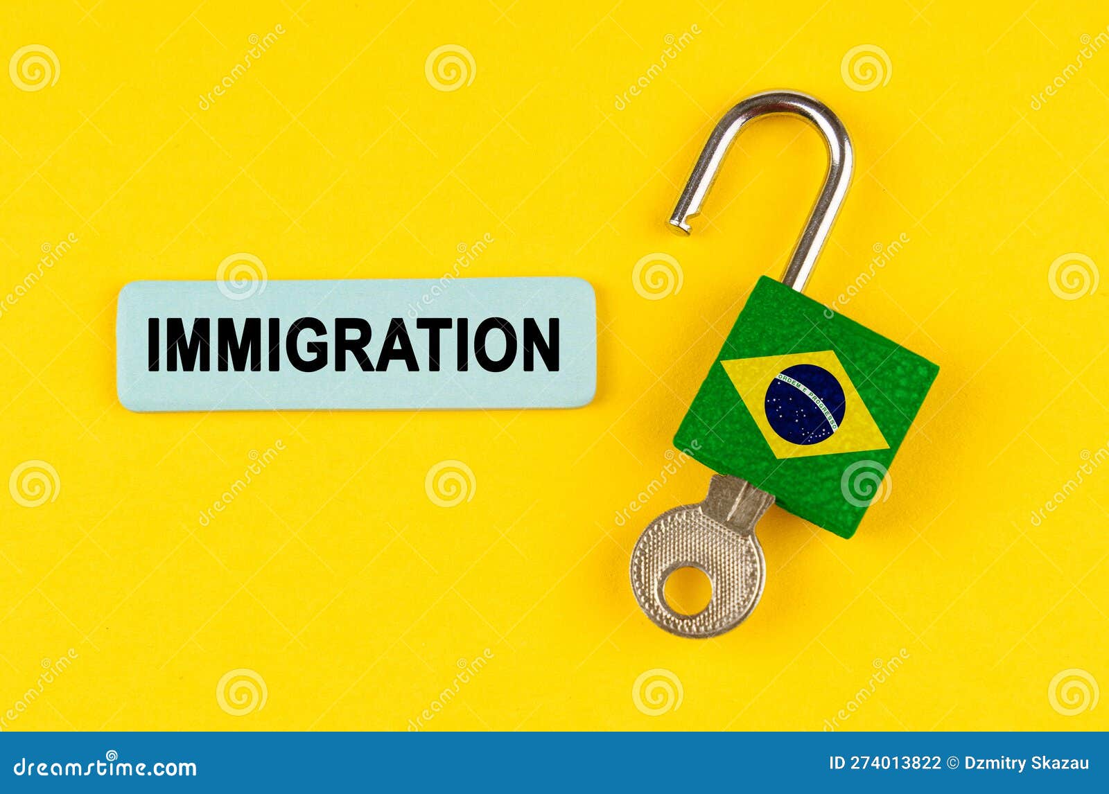 On the Yellow Surface is an Open Lock with a Key and a Sticker with the ...