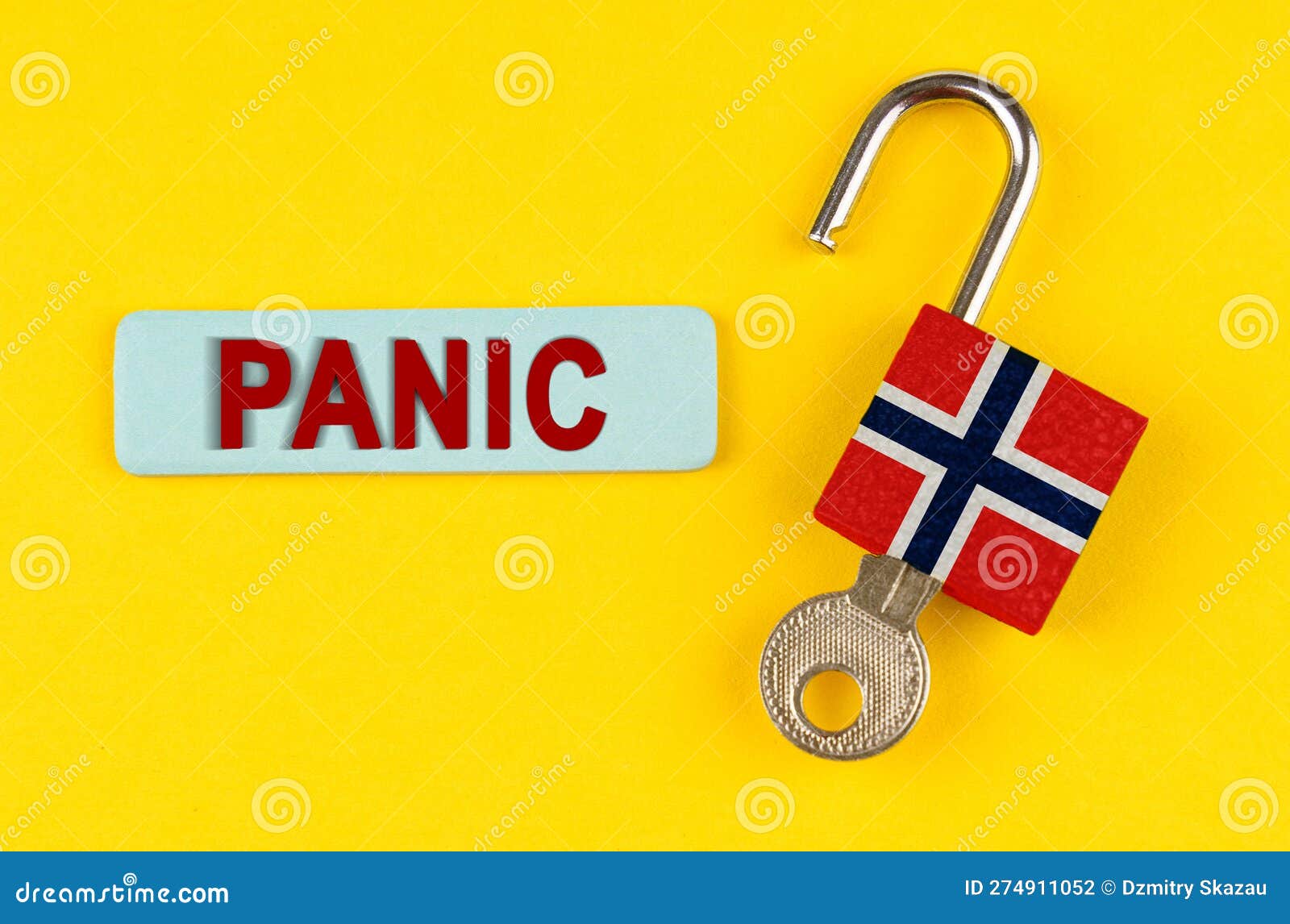 On the Yellow Surface is an Open Lock with a Key and a Sticker with the ...