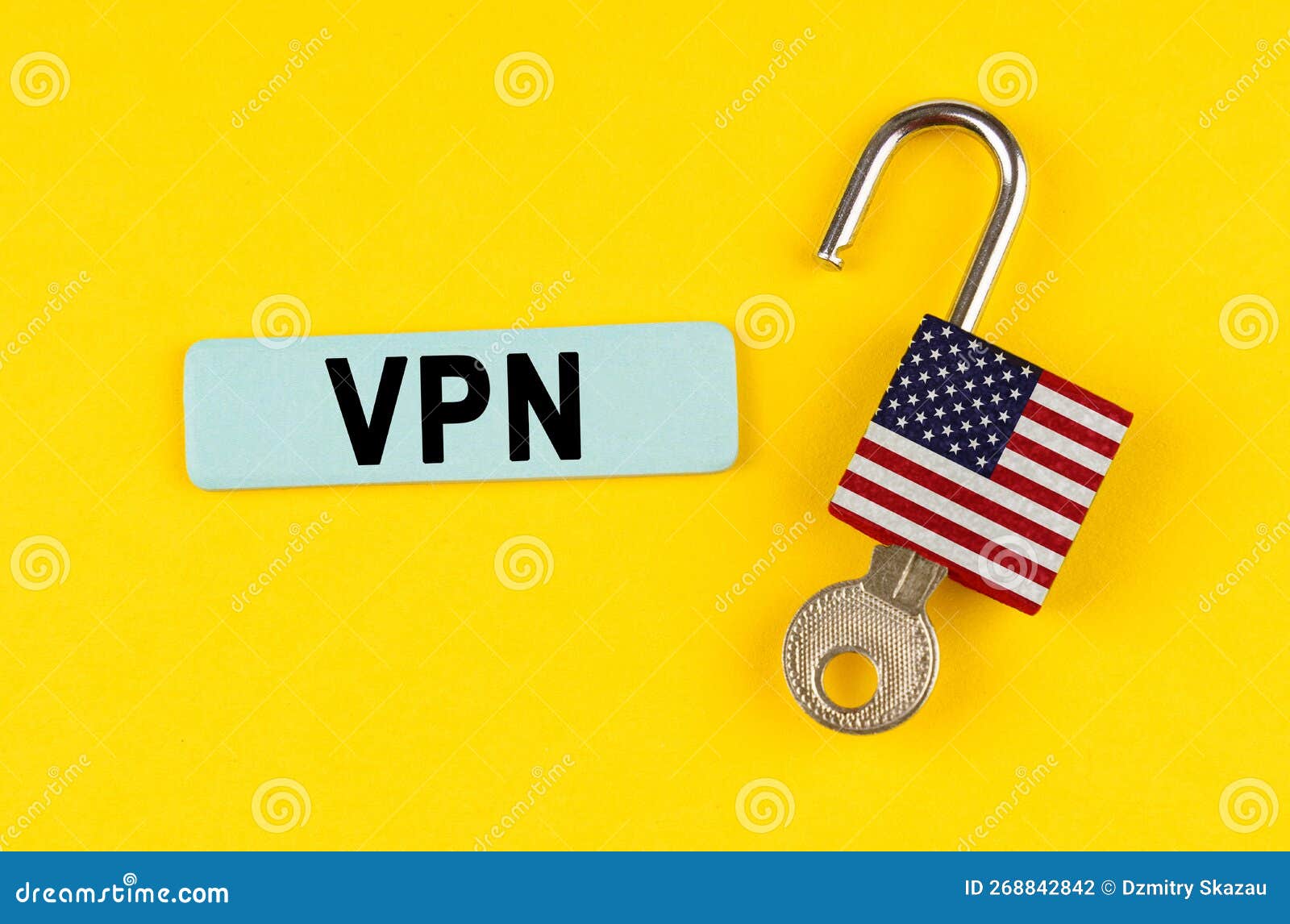 On the Yellow Surface is an Open Lock with a Key and a Sticker with the ...