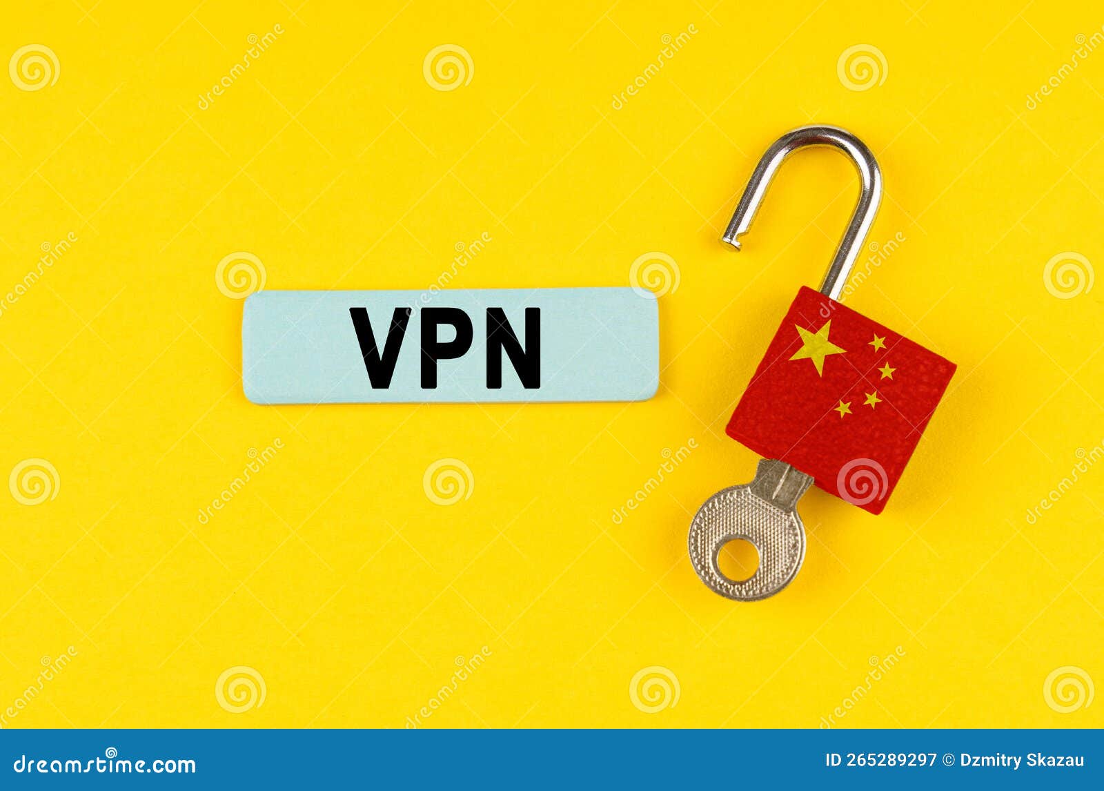 On the Yellow Surface is an Open Lock with a Key and a Sticker with the ...