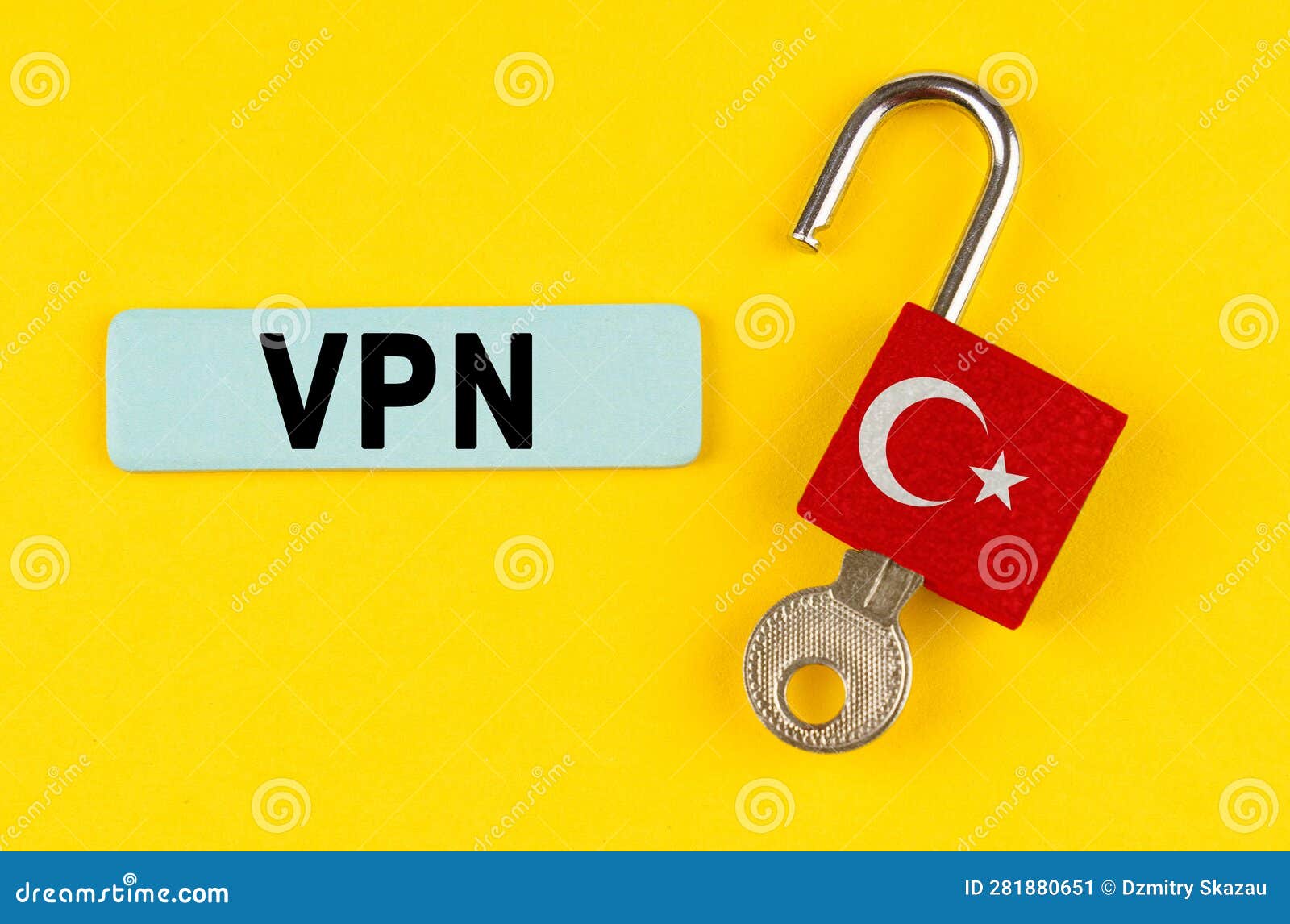 On the Yellow Surface is an Open Lock with a Key and a Sticker with the ...