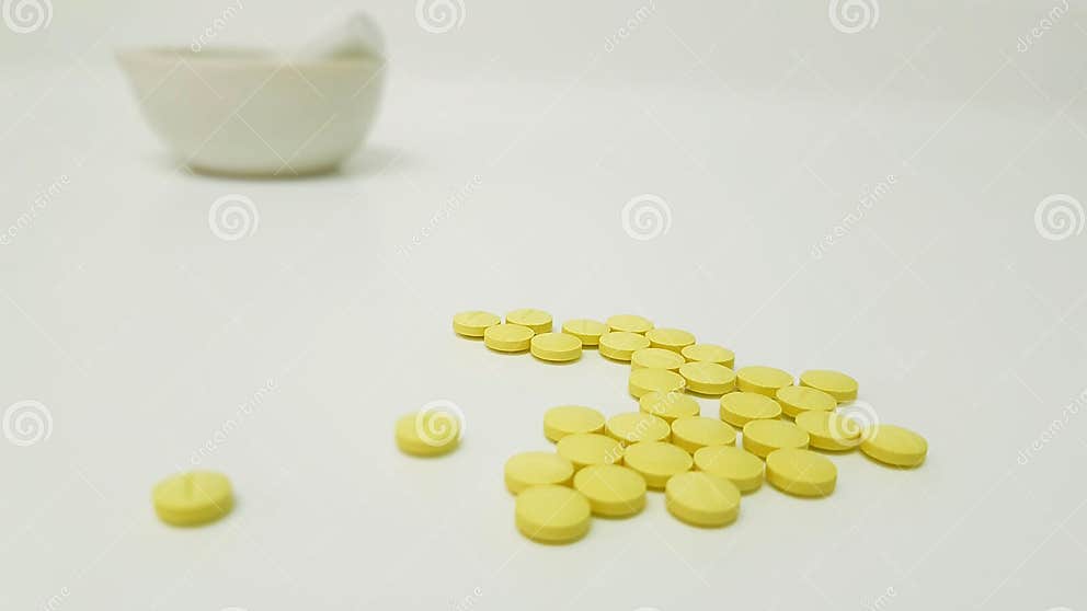 Yellow tablets compounding stock image. Image of preparation - 125352059