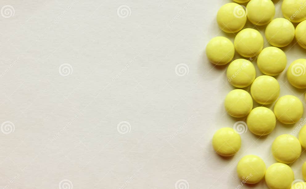 Yellow Tablets on a White Background Close-up . the Tablets are Located ...