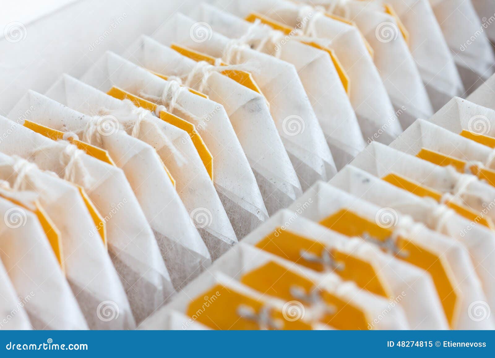 Yellow tagged teabags. stock image. Image of teatime - 48274815