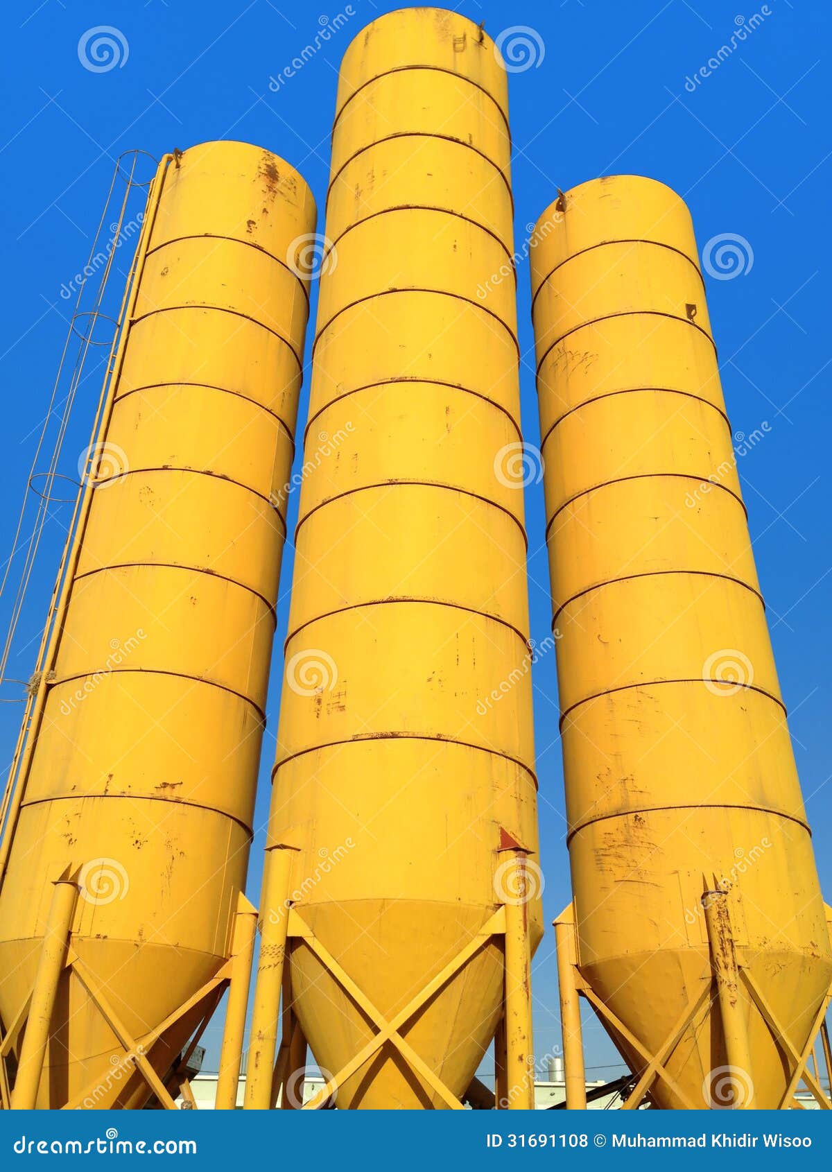 Yellow tanks stock photo. Image of fluid, concrete, architecture - 31691108