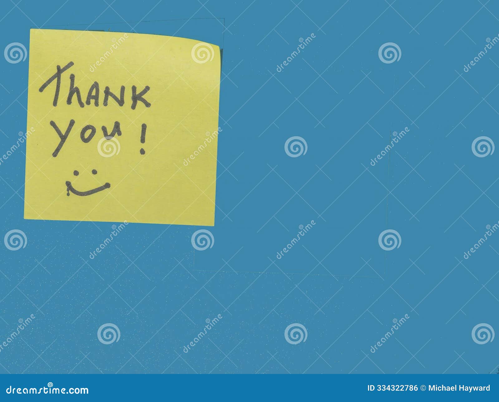 Yellow Thank You Post-it Note with a Smiley Face on a Blue Background ...