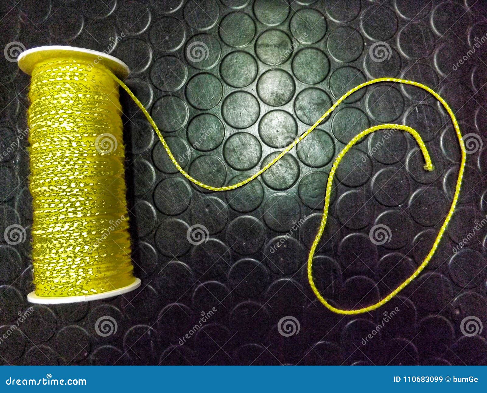 Yellow Thread Spool,on a Black Surface Stock Image - Image of repair ...
