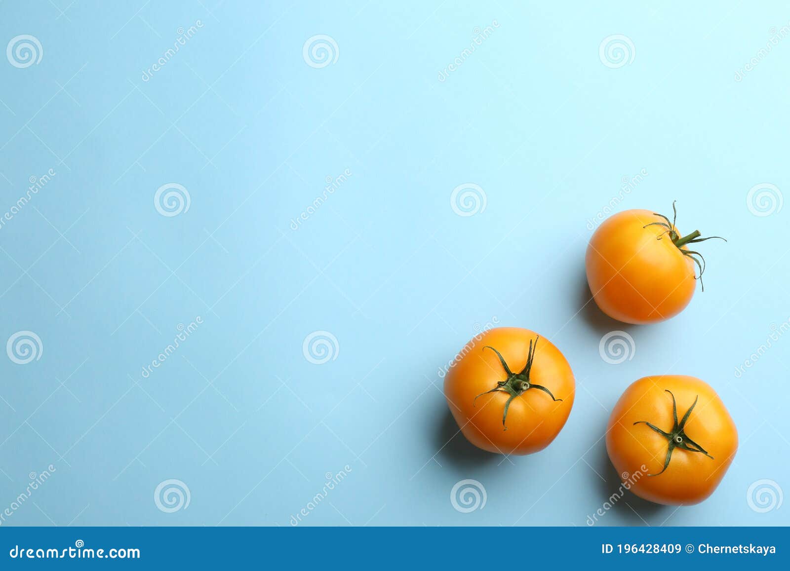 Yellow Tomatoes on Blue Background, Flat Lay. Space for Text Stock ...