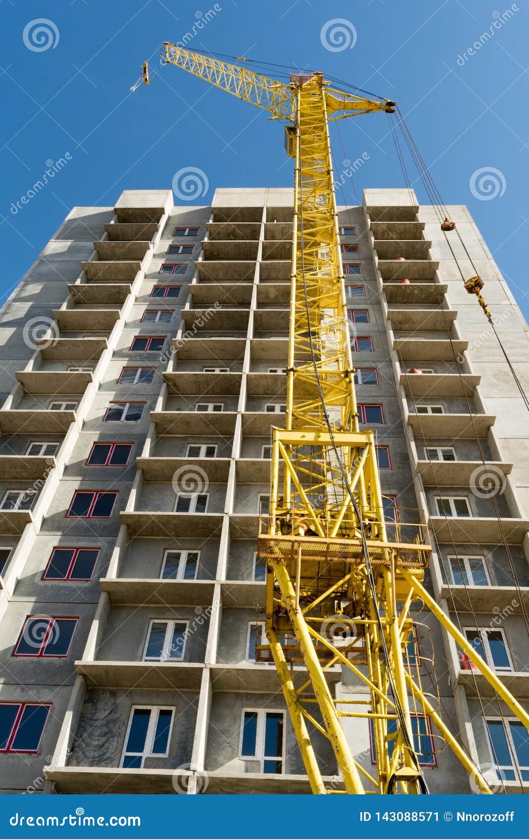 Yellow Tower Crane and the Construction of a Multi-storey Building ...