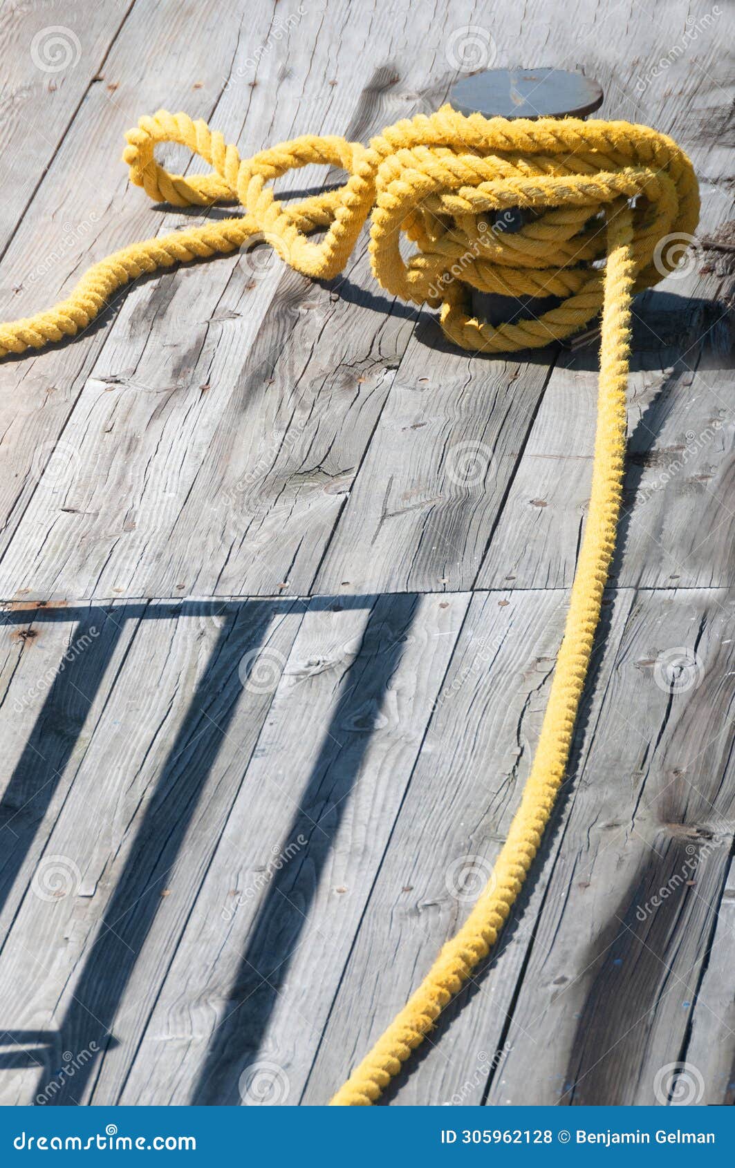 Yellow Towing Rope Wound on a Bollard on a Pier Stock Photo - Image of ...