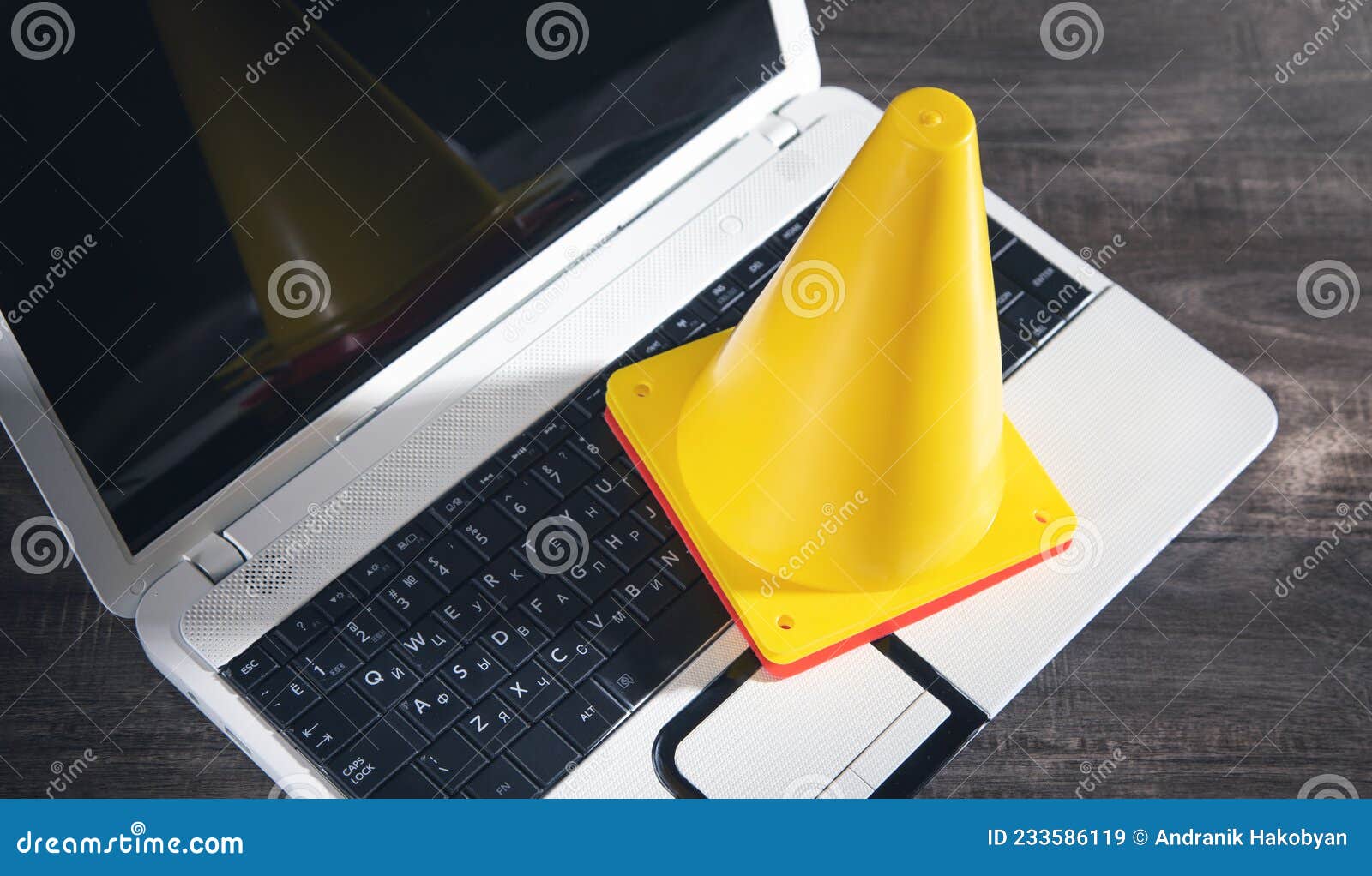 Yellow Traffic Cone on Laptop Keyboard Stock Image - Image of laptop ...