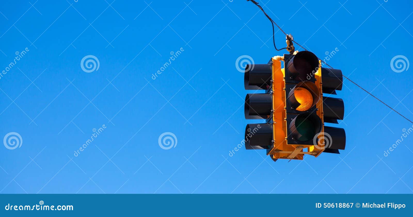 A Yellow Traffic Light with a Sky Blue Background Stock Image - Image ...