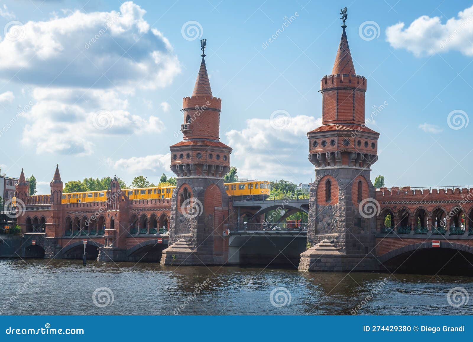 Yellow Train at Oberbaum Bridge (Oberbaumbrucke) - Berlin, Germany ...