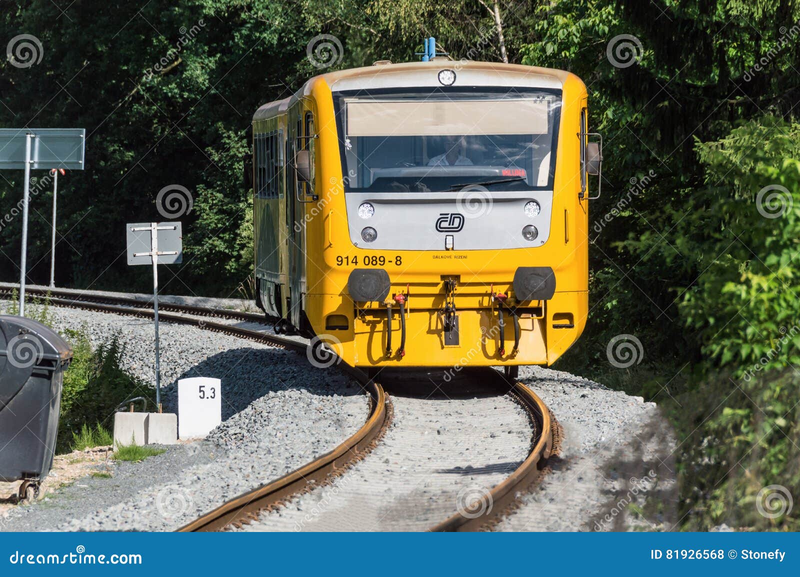 A Yellow Train Proceeding on the Tracks Editorial Stock Photo - Image ...