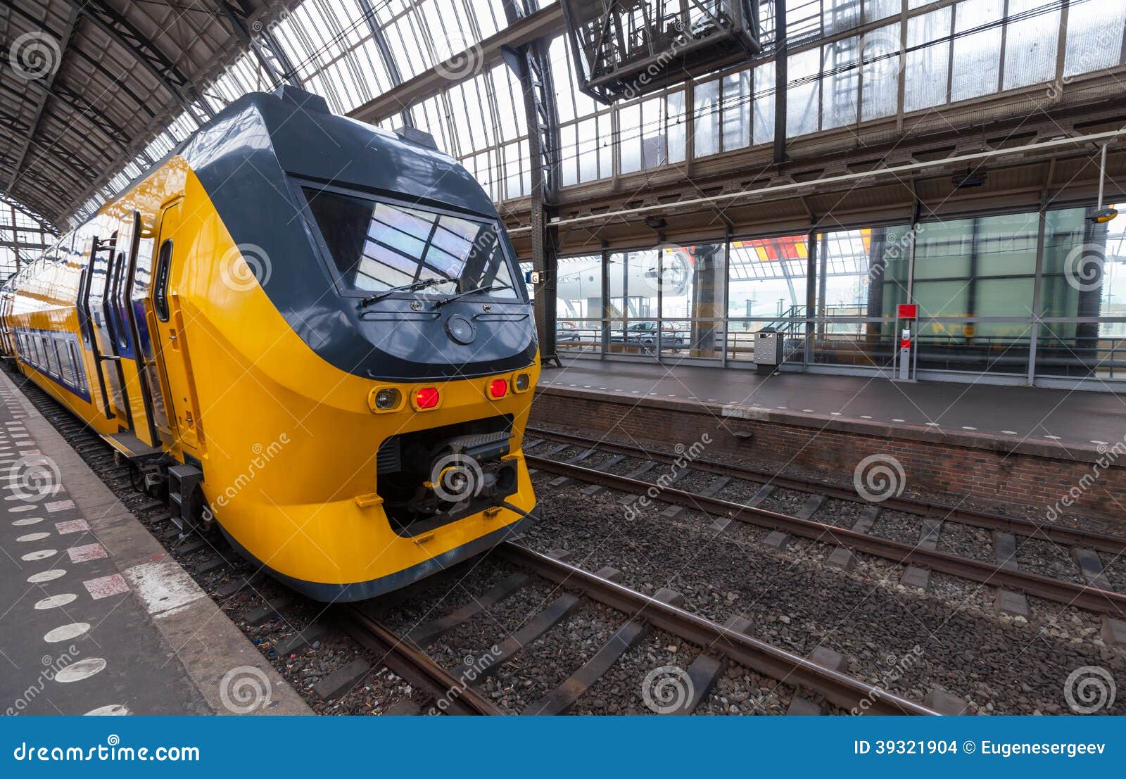 Yellow Train Stands in Amsterdam Station Stock Photo - Image of ...