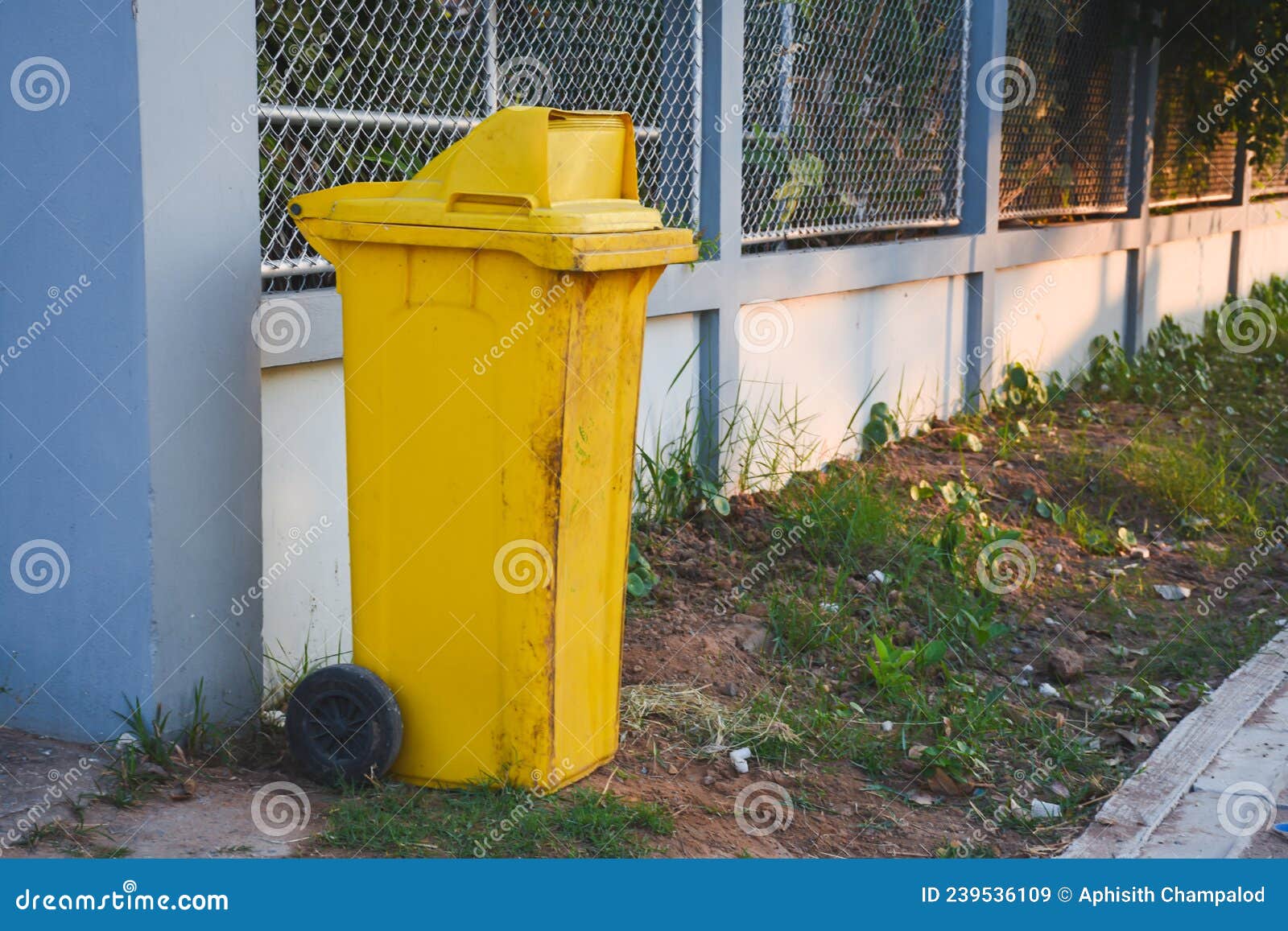 Yellow Trash Bin on the Floor Stock Image - Image of blue, earth: 239536109