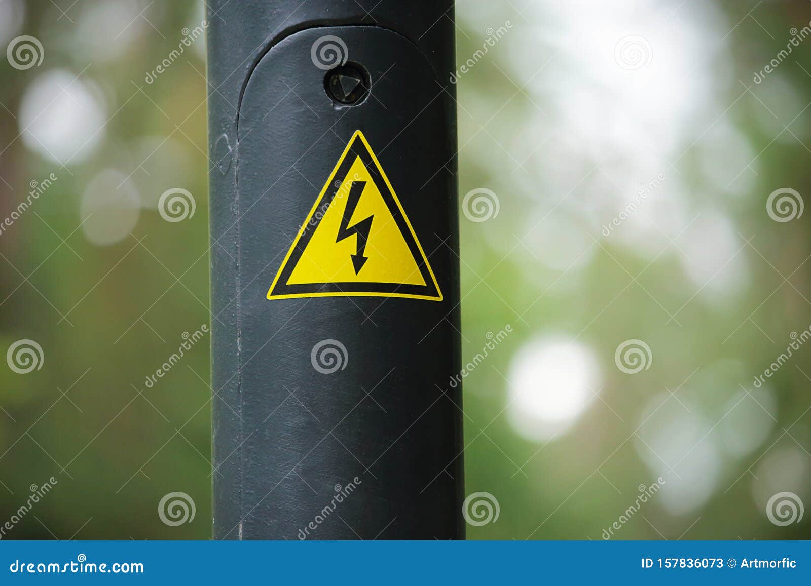 Yellow Triangular Electricity Caution Sign on a Wire Pole Stock Image ...