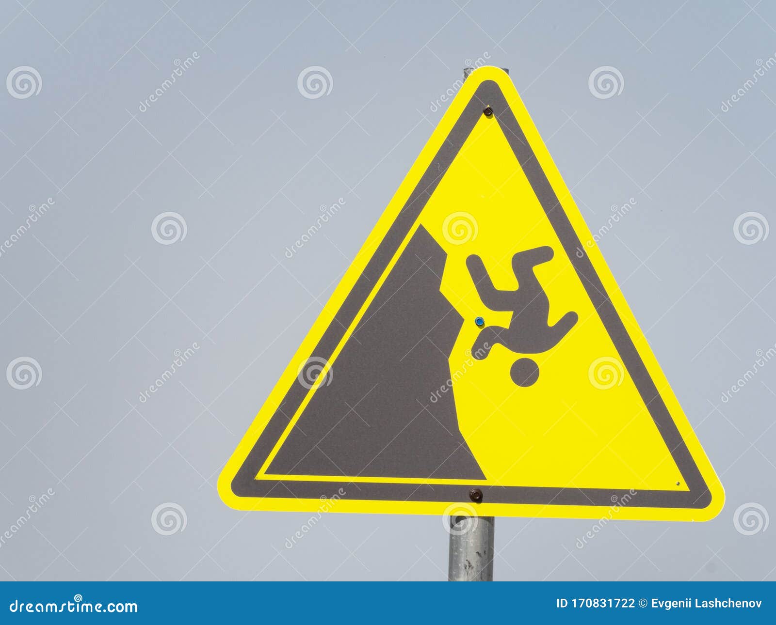 Yellow Triangular Sign with a Man Falling from a Cliff on a Gray ...