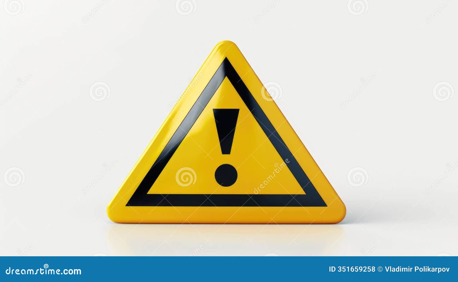 A Yellow Triangular Warning Sign with a Black Exclamation Point ...