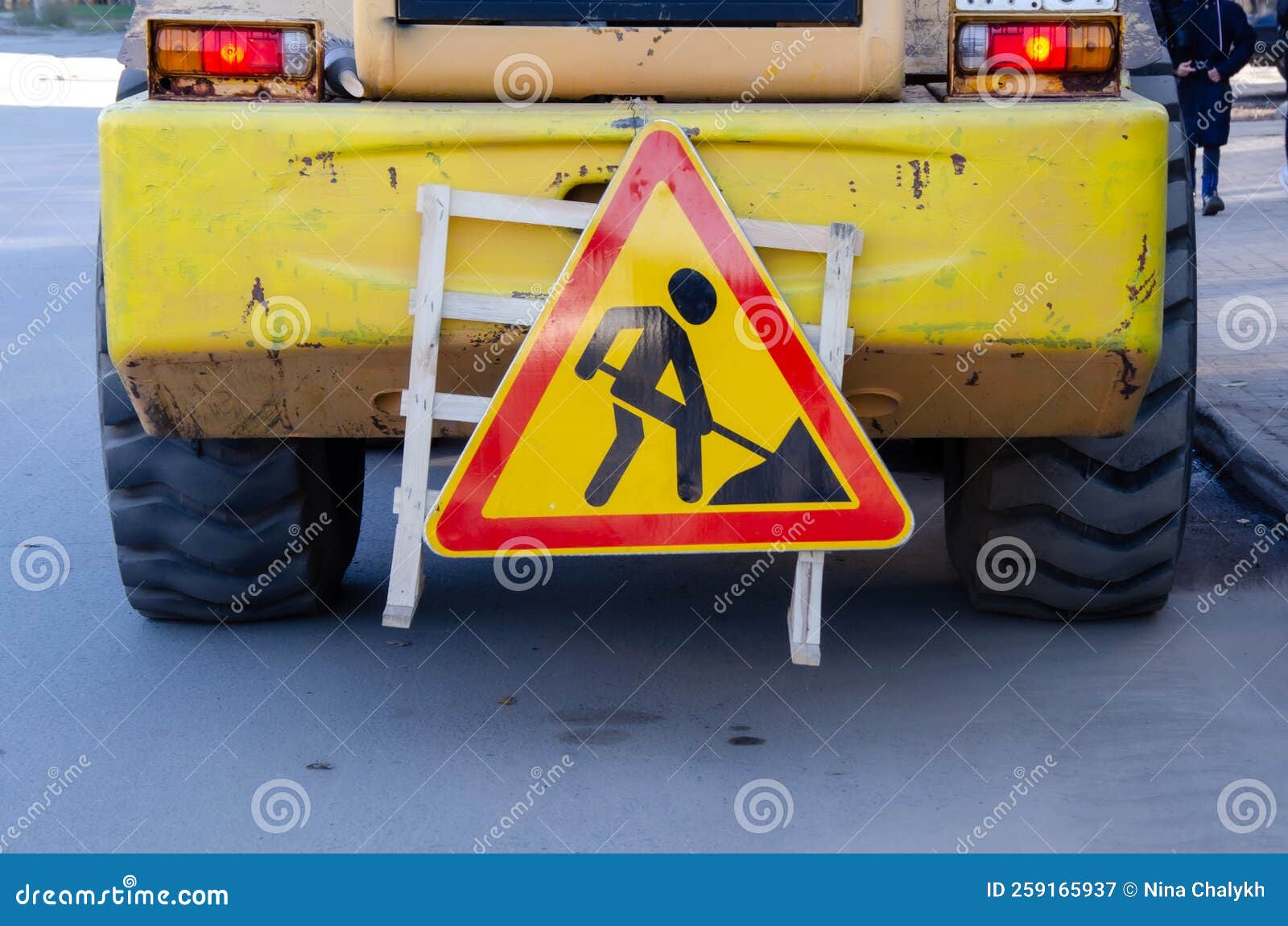Yellow Triangular Warning Sign Work in Progress Next To Construction ...