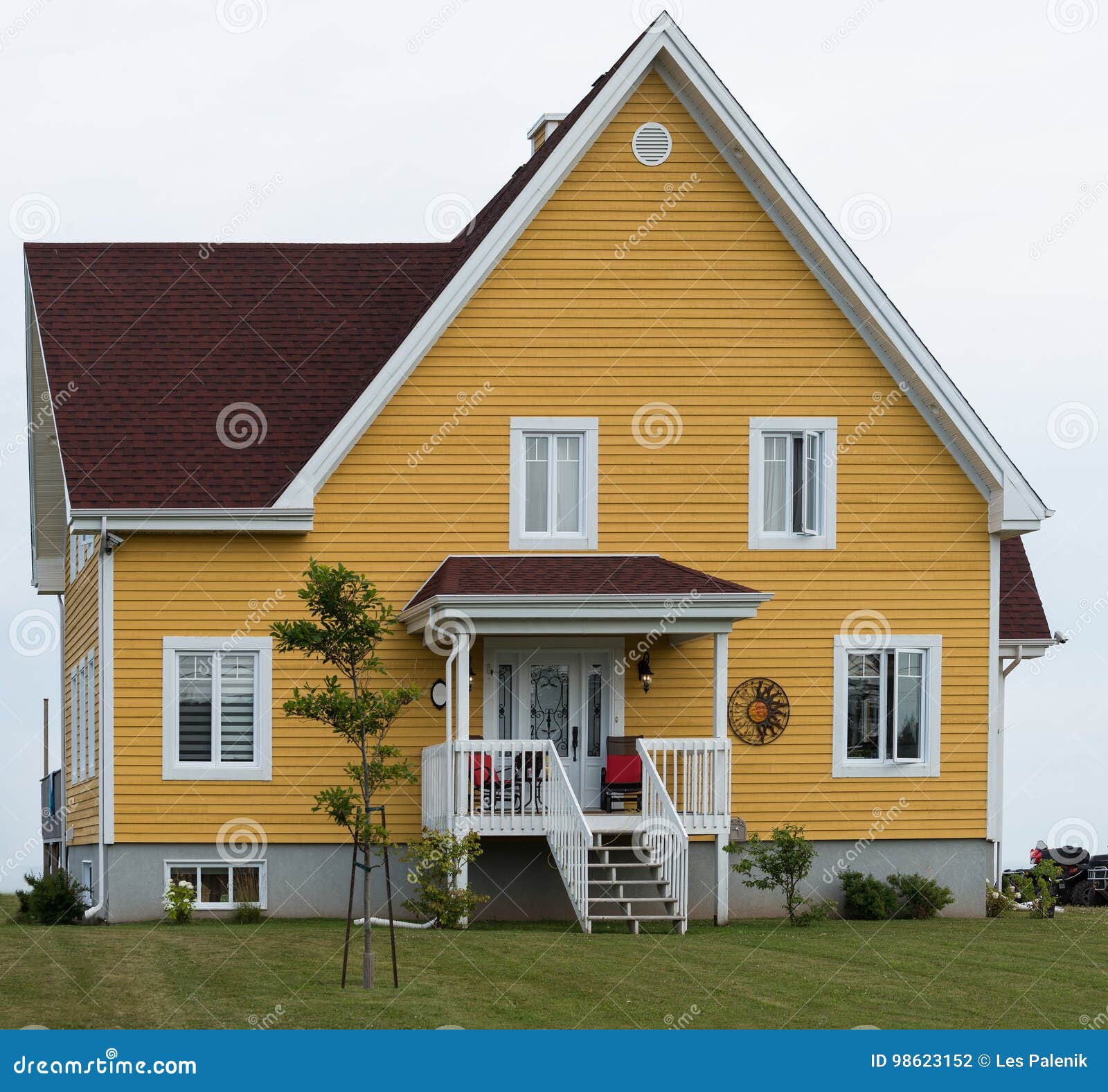 Yellow two storey house stock photo. Image of colors - 98623152