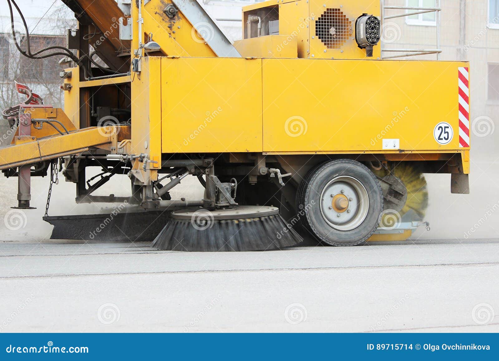 Yellow Urban Sweeper Cleans Road from Dirt with a Round Brush in the ...