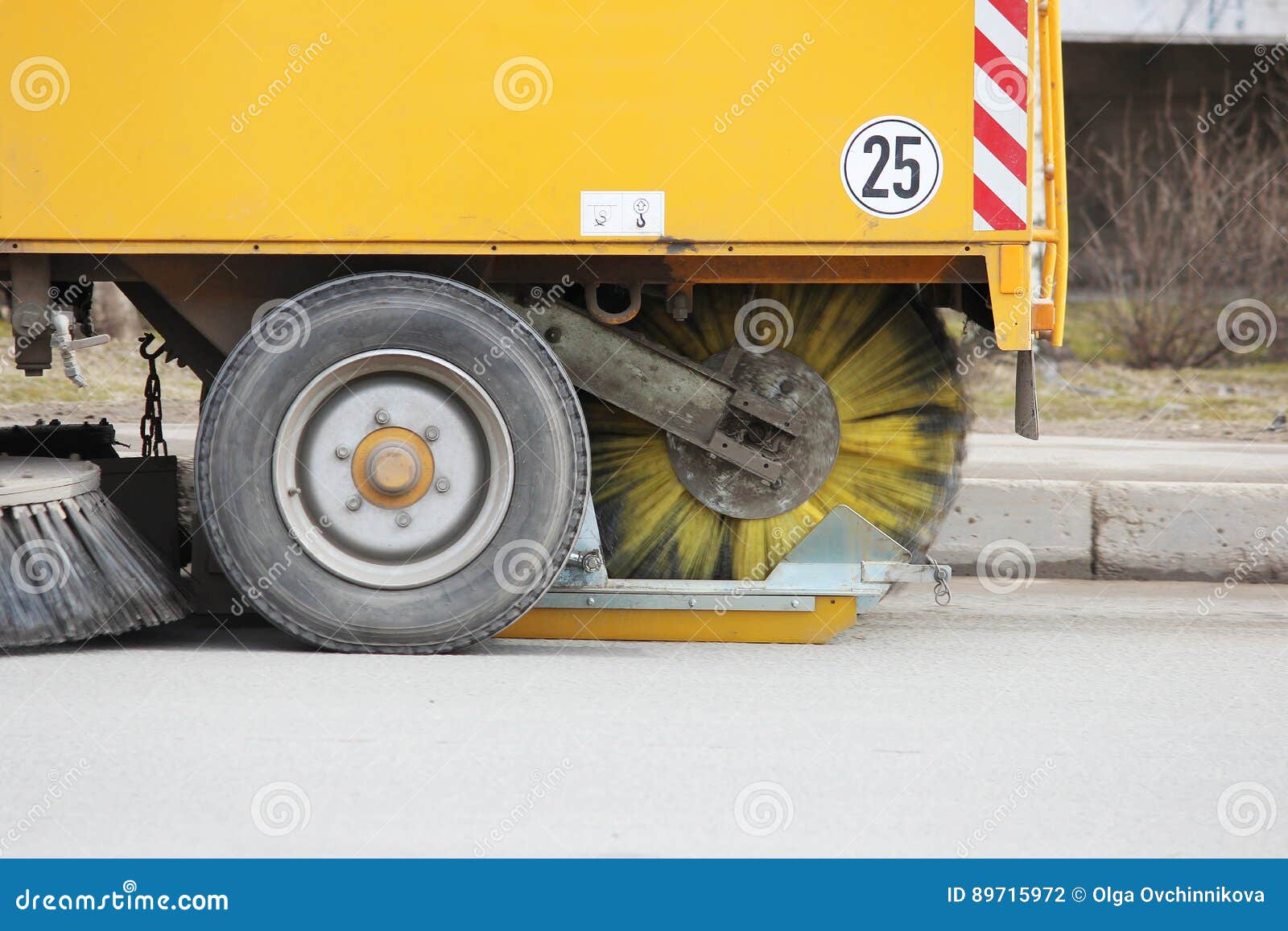 Yellow Urban Sweeper Cleans Road from Dirt with a Round Brush in the ...