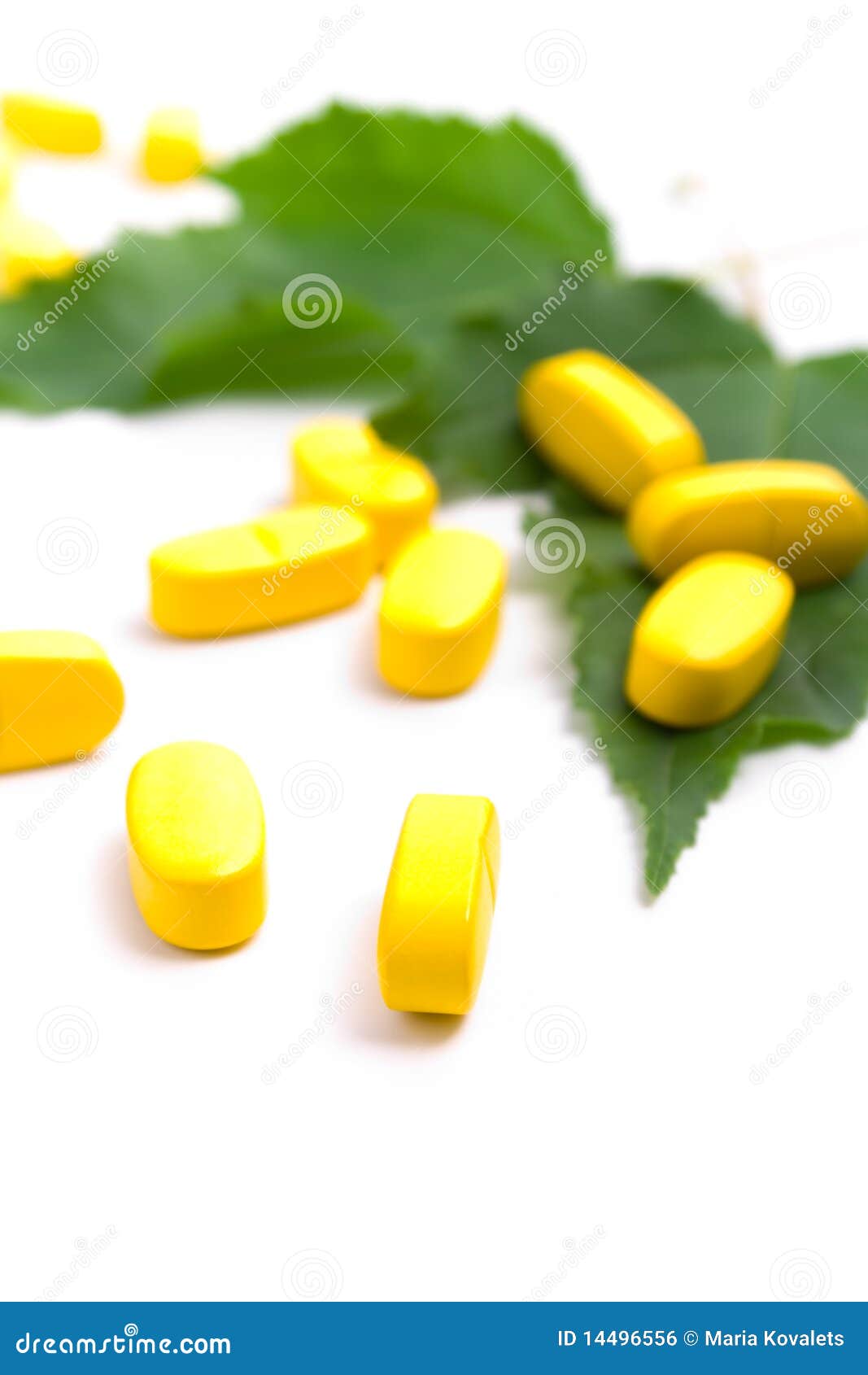Yellow vitamin pills stock photo. Image of isolated, herbal - 14496556