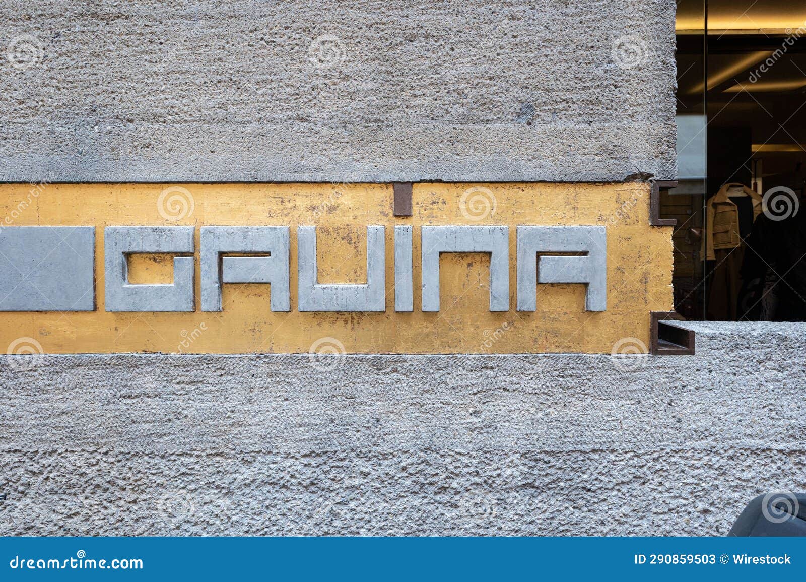 Yellow Wall Displays a Building S Logo Stock Image - Image of ...