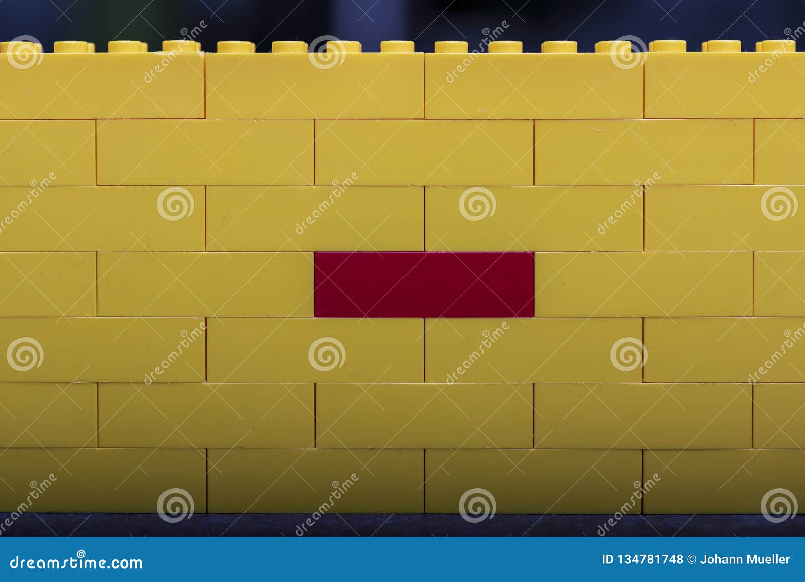 Yellow wall with toy brick stock photo. Image of texture - 134781748