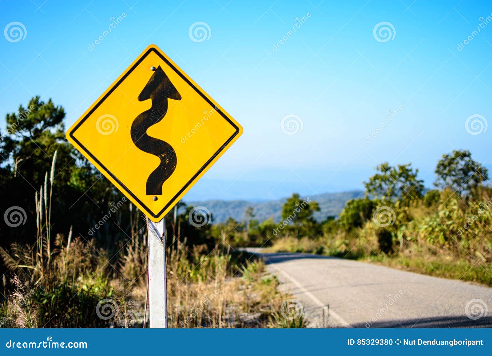 Yellow Warning Multi Curve Signpost Stock Photo - Image of traffic ...