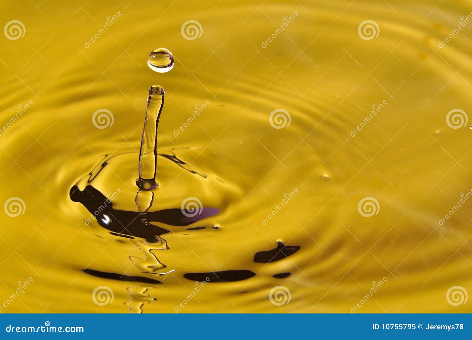 Yellow Water Drop and Splash Stock Image - Image of amber, concentric ...